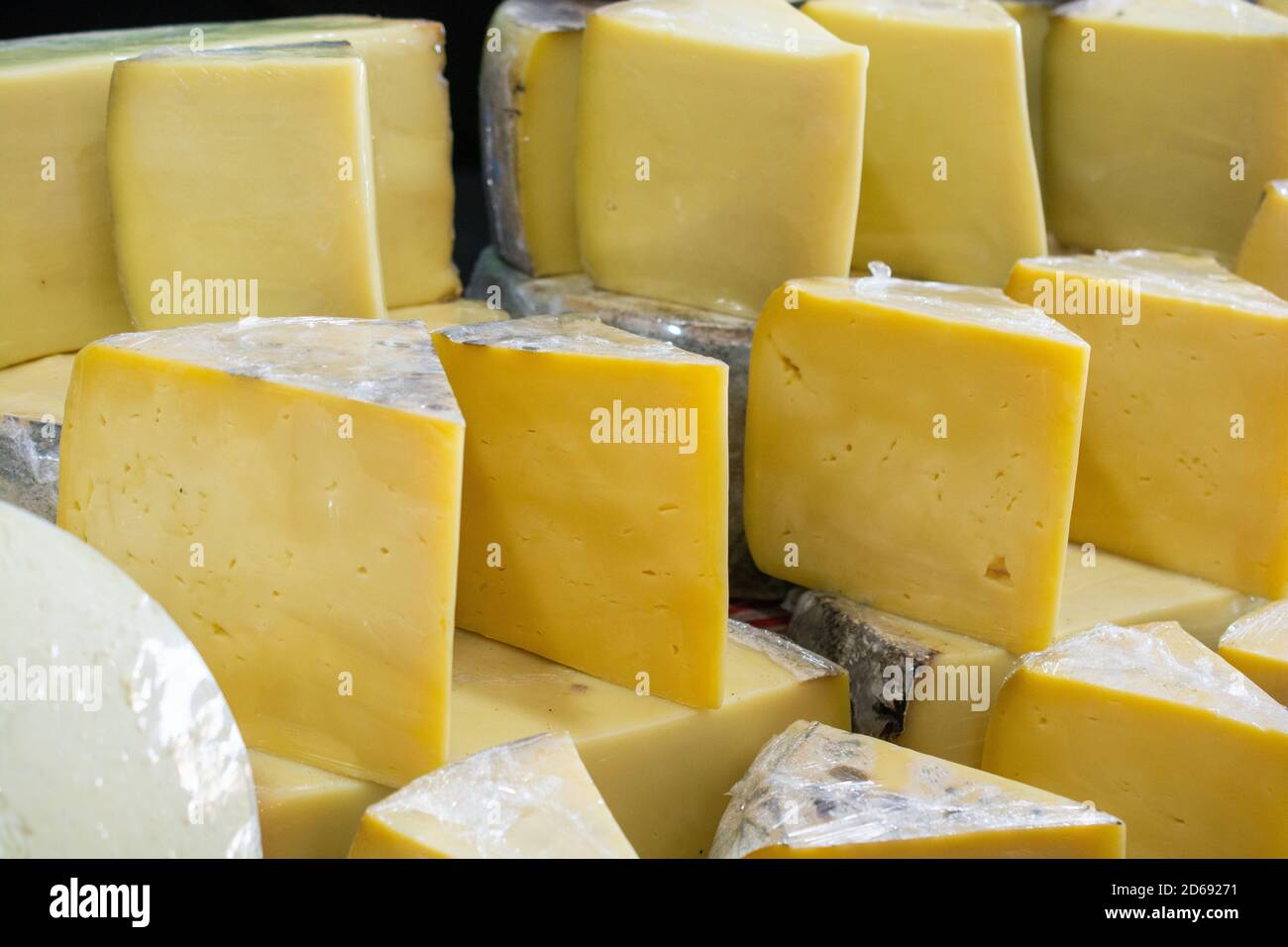 cuts of kashkaval or kasseri cheese for sale on the shelf Stock Photo ...