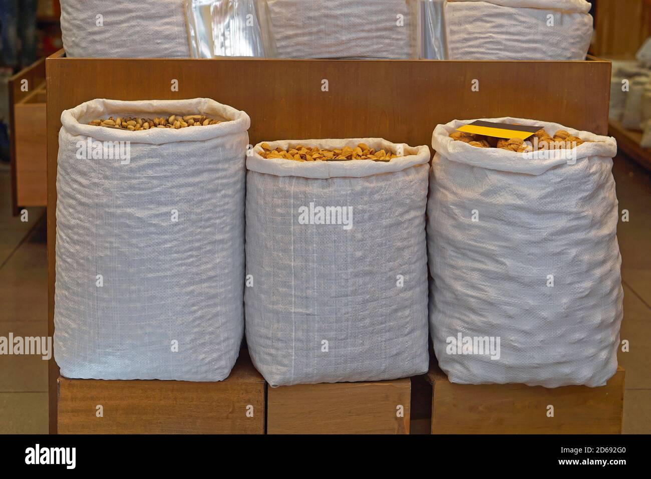 Three sacks filled with nuts bulk food Stock Photo - Alamy