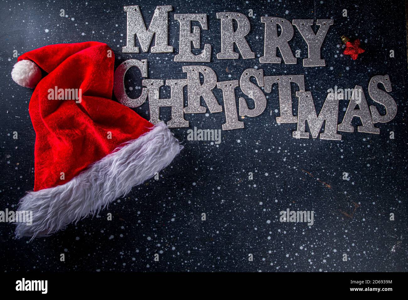 Christmas holiday card background. Santa hat with Christmas and New ...