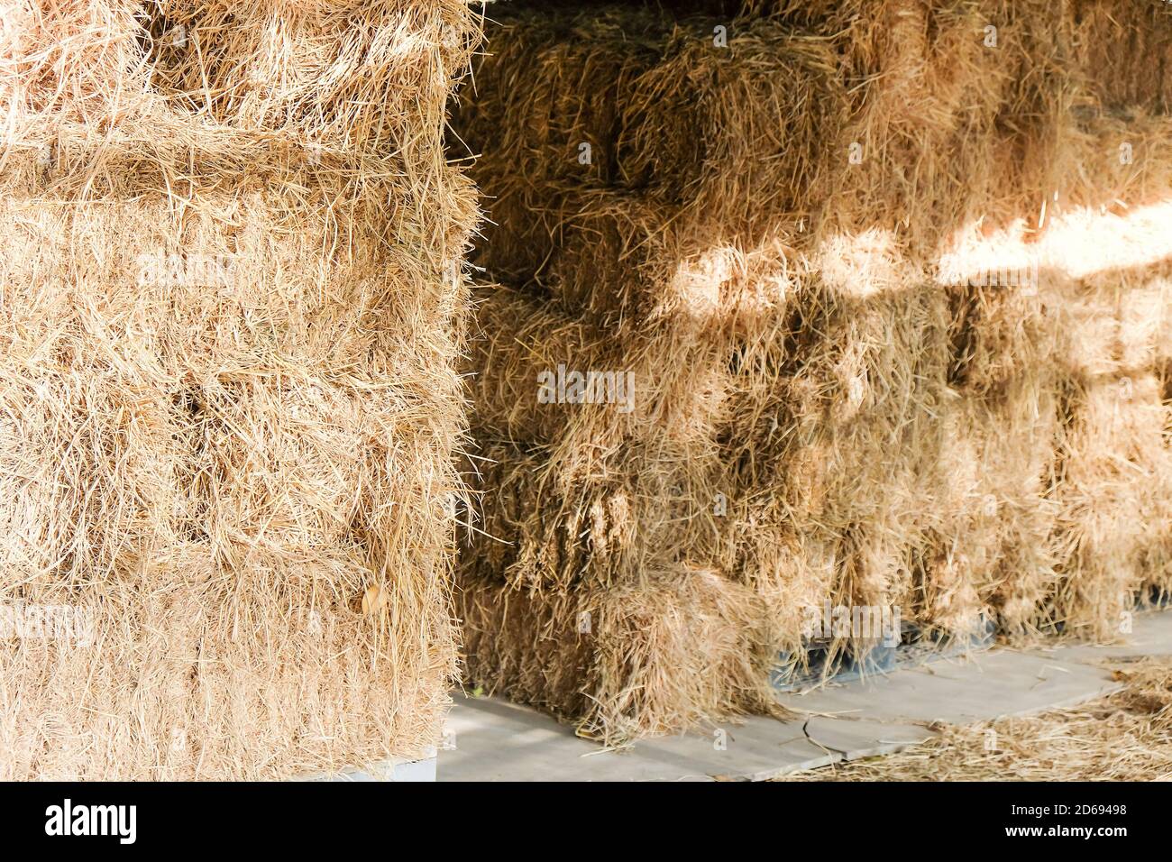 stacked hay in agricultural stall Stock Photo - Alamy