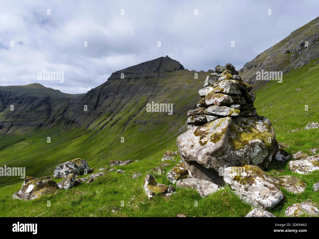 Cairn in the mountains of Vagar, part of the Faroe Islands. Cairns are ...
