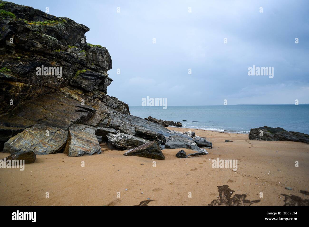 A rocky sandy beach off the coast of France Stock Photo - Alamy