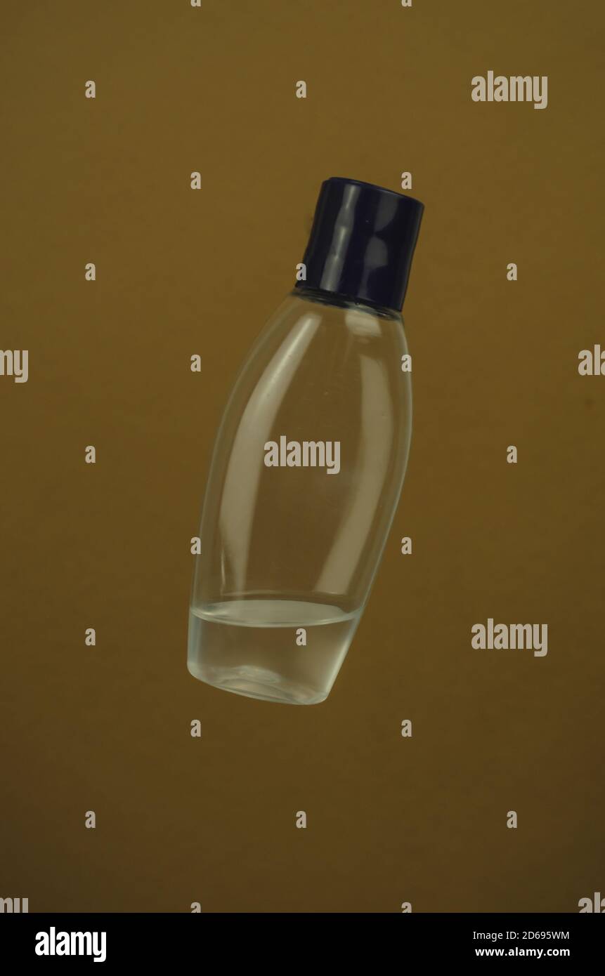 Vertical shot of a water bottle on brown background Stock Photo - Alamy