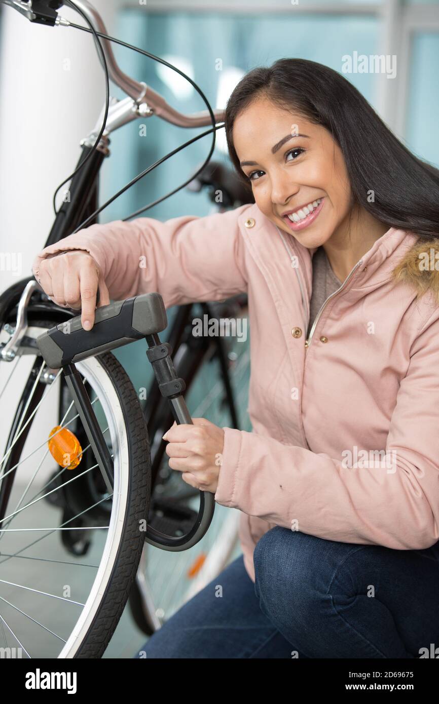 girl securing a bicycle lock Stock Photo - Alamy