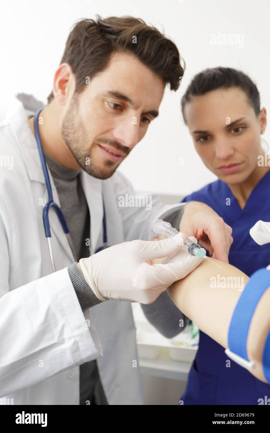 doctor with an injection needle Stock Photo - Alamy