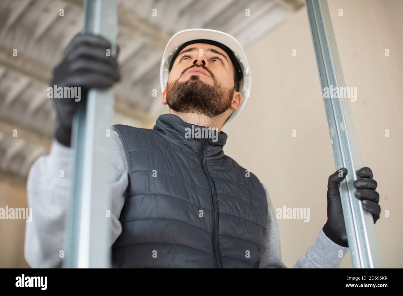 line electrician builder engineer worker at indoor construction site ...
