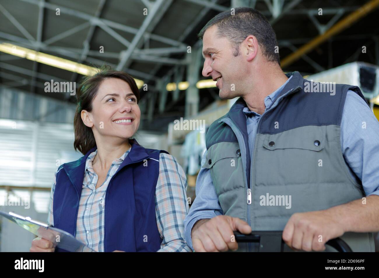 portrait of happy workers in warehouse Stock Photo - Alamy