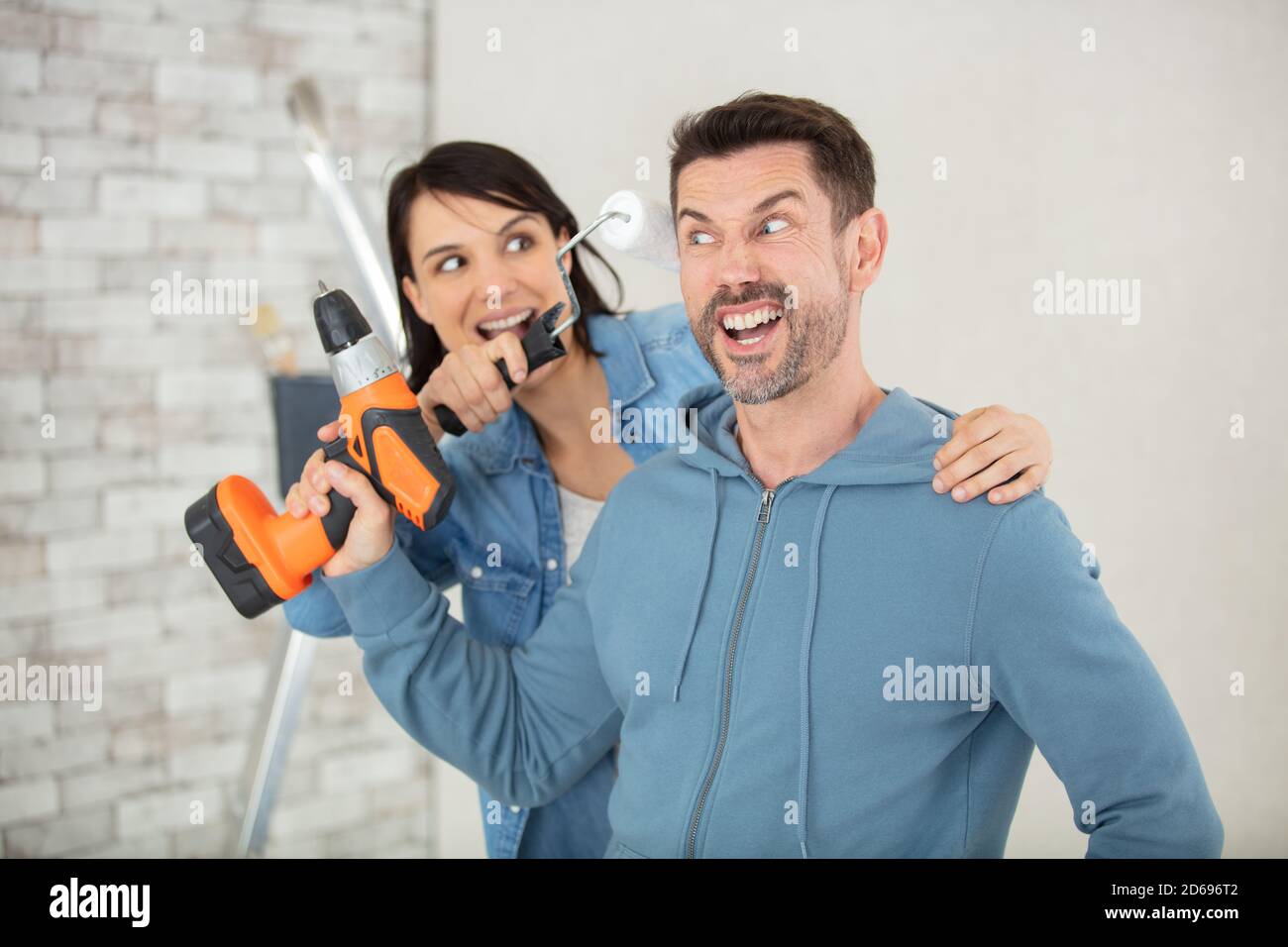 couple having fun while renovating their new home Stock Photo - Alamy couple having fun while renovating their new home Stock Photo - Alamy