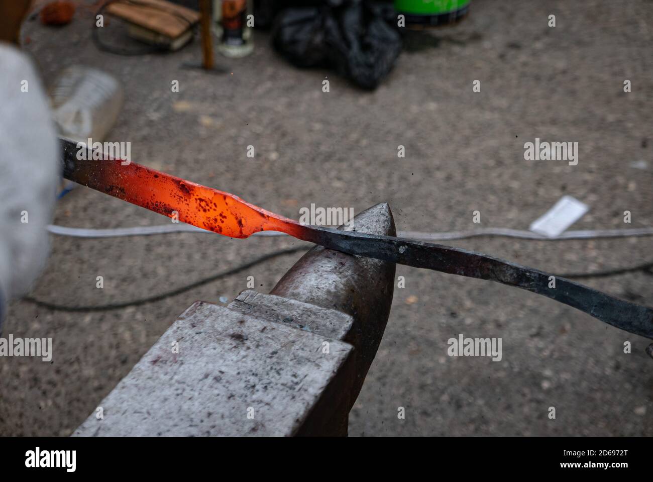 Red hot metal detail on the anvil Stock Photo - Alamy