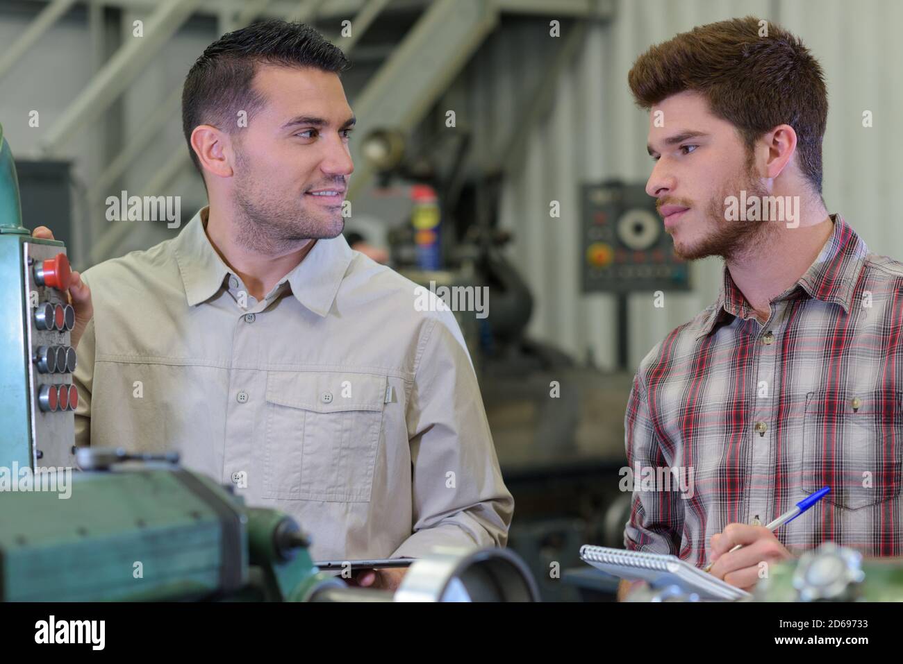 mechanical engineer on tour to factory Stock Photo - Alamy