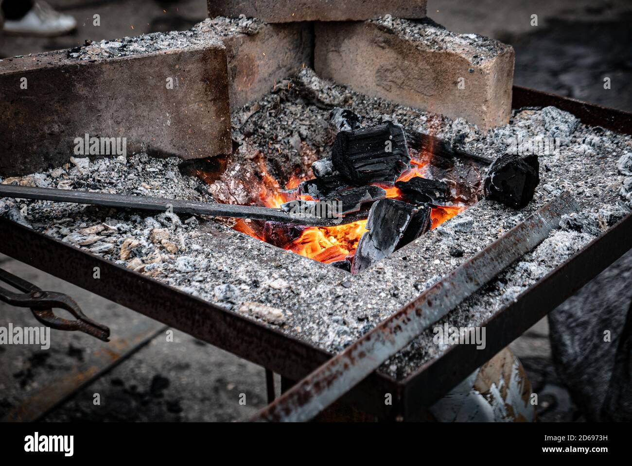 Metal detail in a blacksmith fireplace filled by coals Stock Photo - Alamy