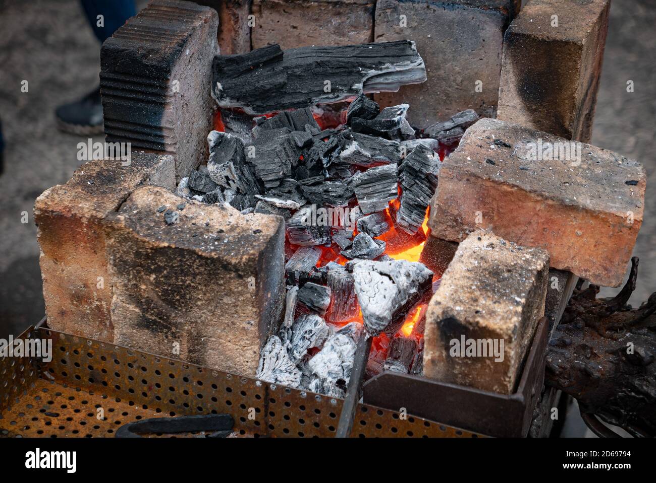 Wood coals in a hand made fireplace Stock Photo - Alamy