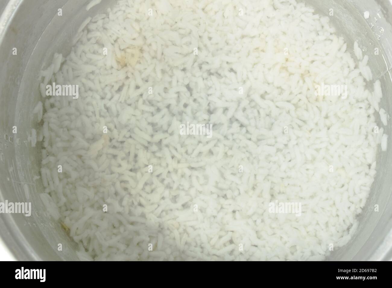 rice sticked in cooking pot soak water for cleaning Stock Photo - Alamy