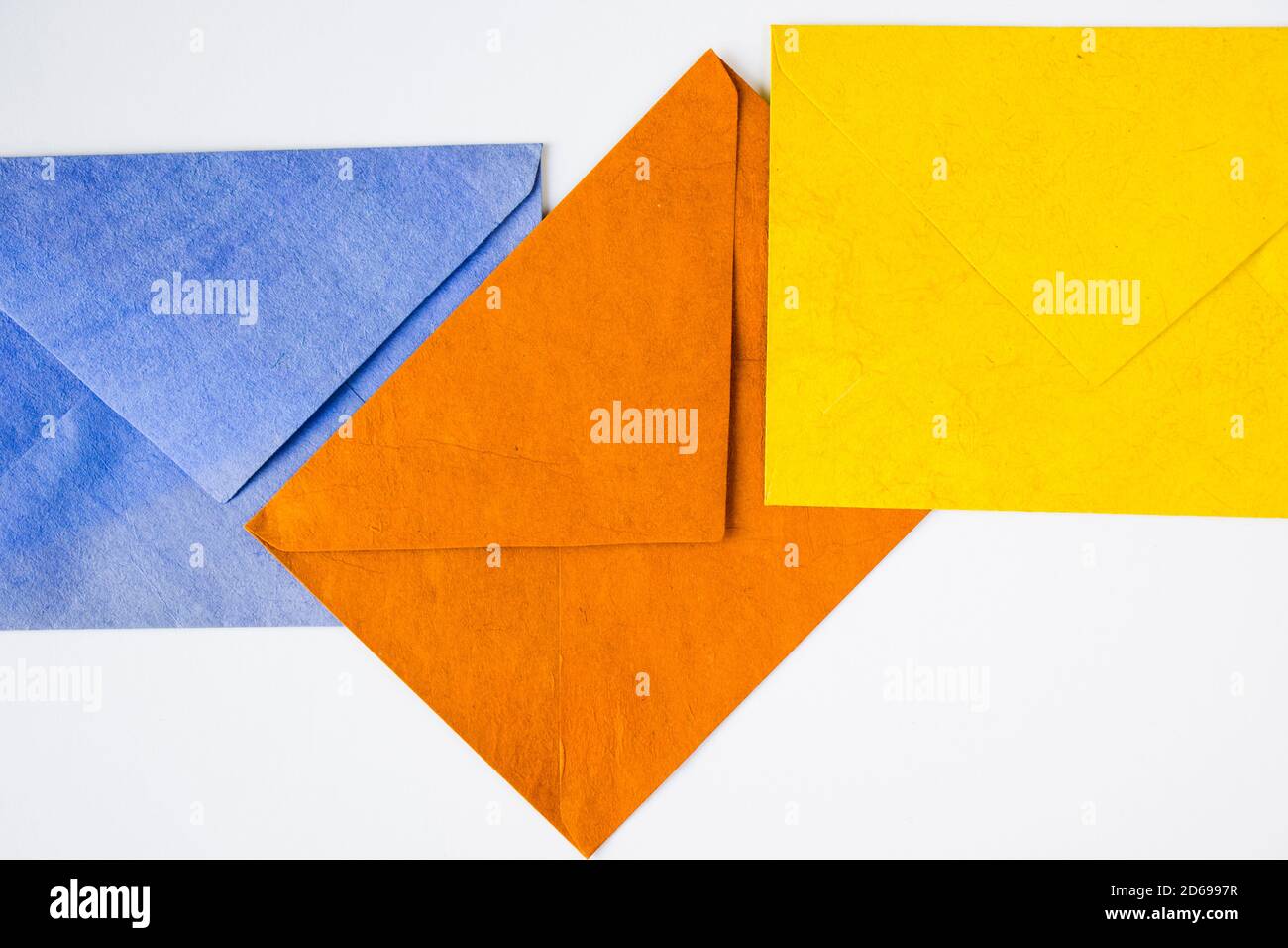 Three envelope on the white background Stock Photo - Alamy