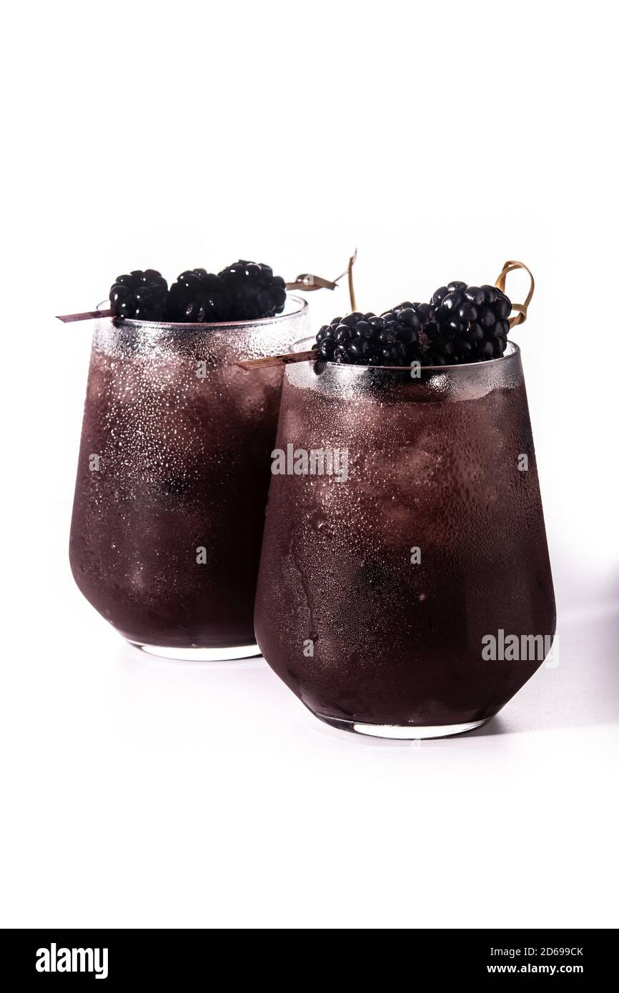 Fresh blackberry cocktail in cold glass isolated on white background ...