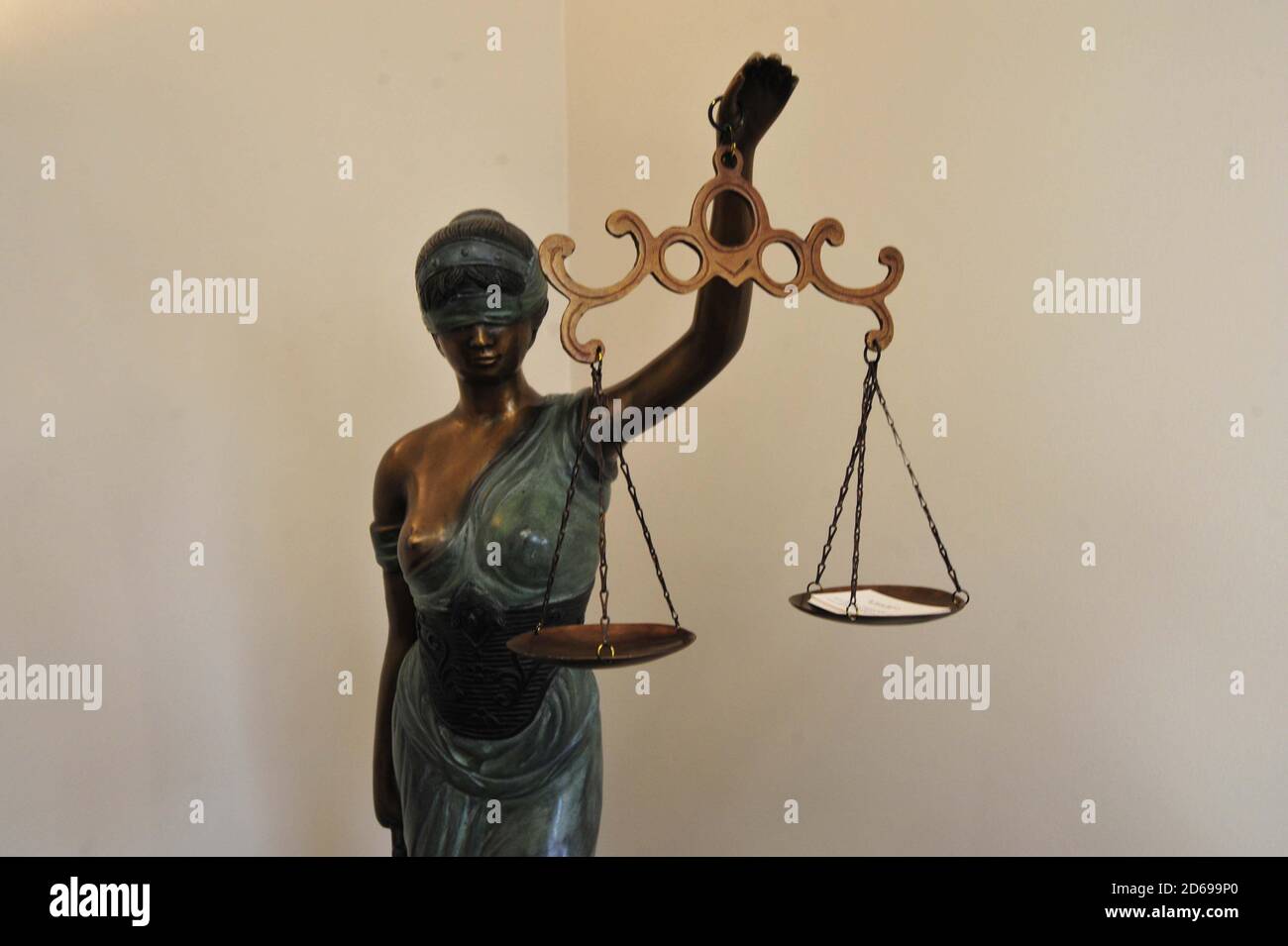 Statue of Lady Justice with scales in her hand in a court room Stock ...