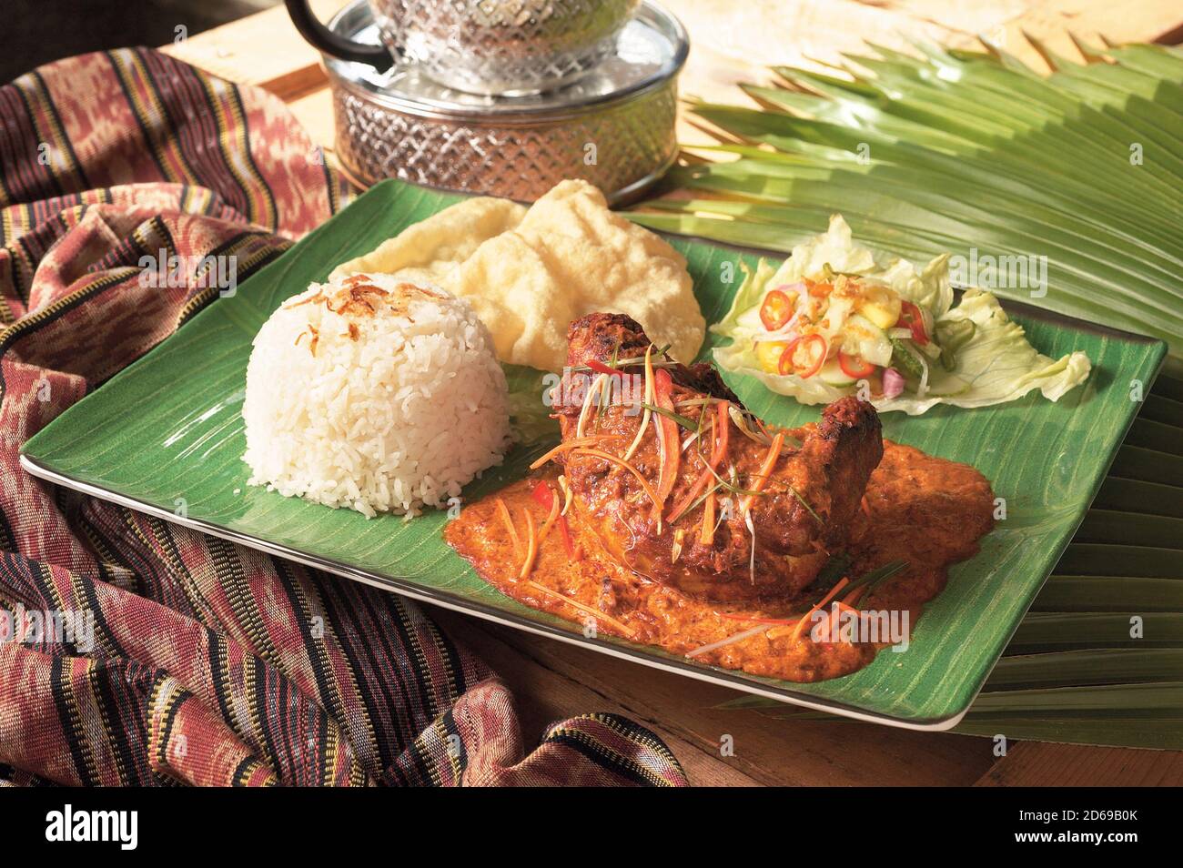Indian cuisine chicken curry with achaar, rice and papadum Stock Photo ...