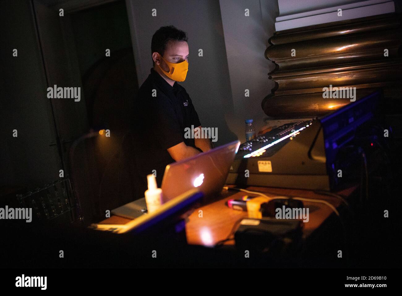Technicians monitor the performance of singer songwriter Dan Olsen as ...