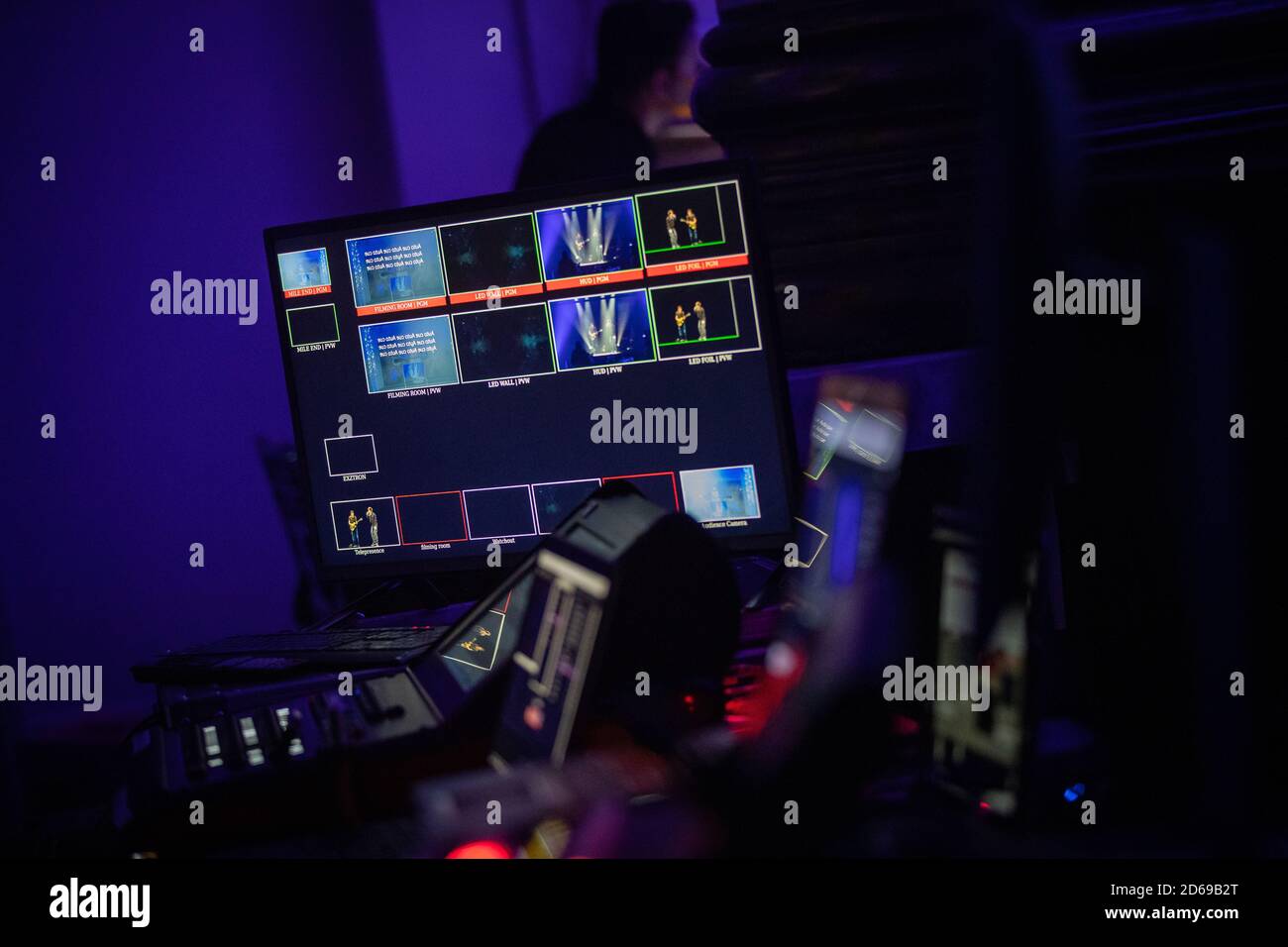 Technicians monitor the performance of singer songwriter Dan Olsen as ...