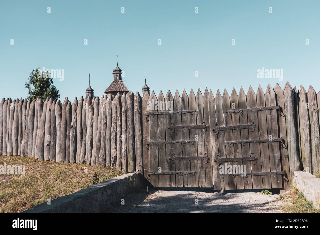 Wooden medieval fence and gates to Zaporozhian Sich, fort facade with ...