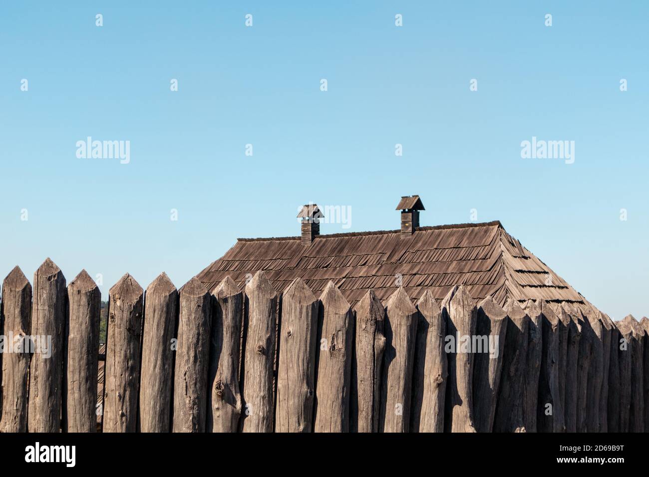 Wooden fence around the Zaporozhian Sich, fort facade with old house ...