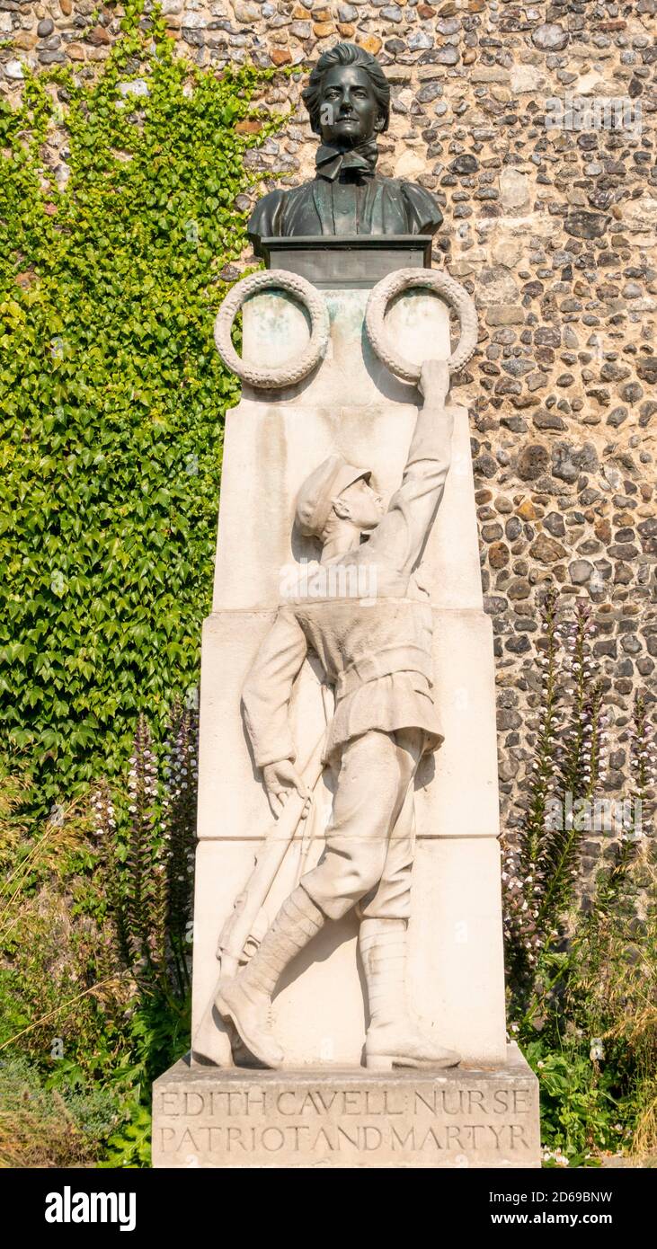 Bronze bust of Edith Cavell statue on a plinth with a relief of a ...