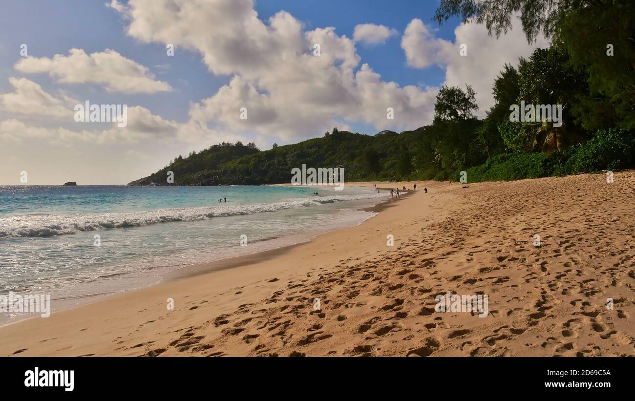 Tourists enjoying their holidays (swimming, sunbathing, relaxing) on ...