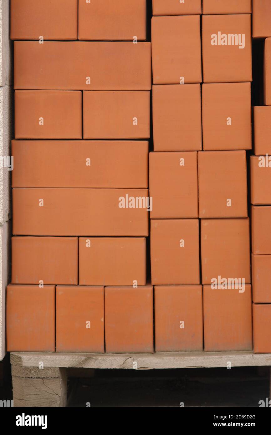 Clay brown bricks on construction market Stock Photo - Alamy