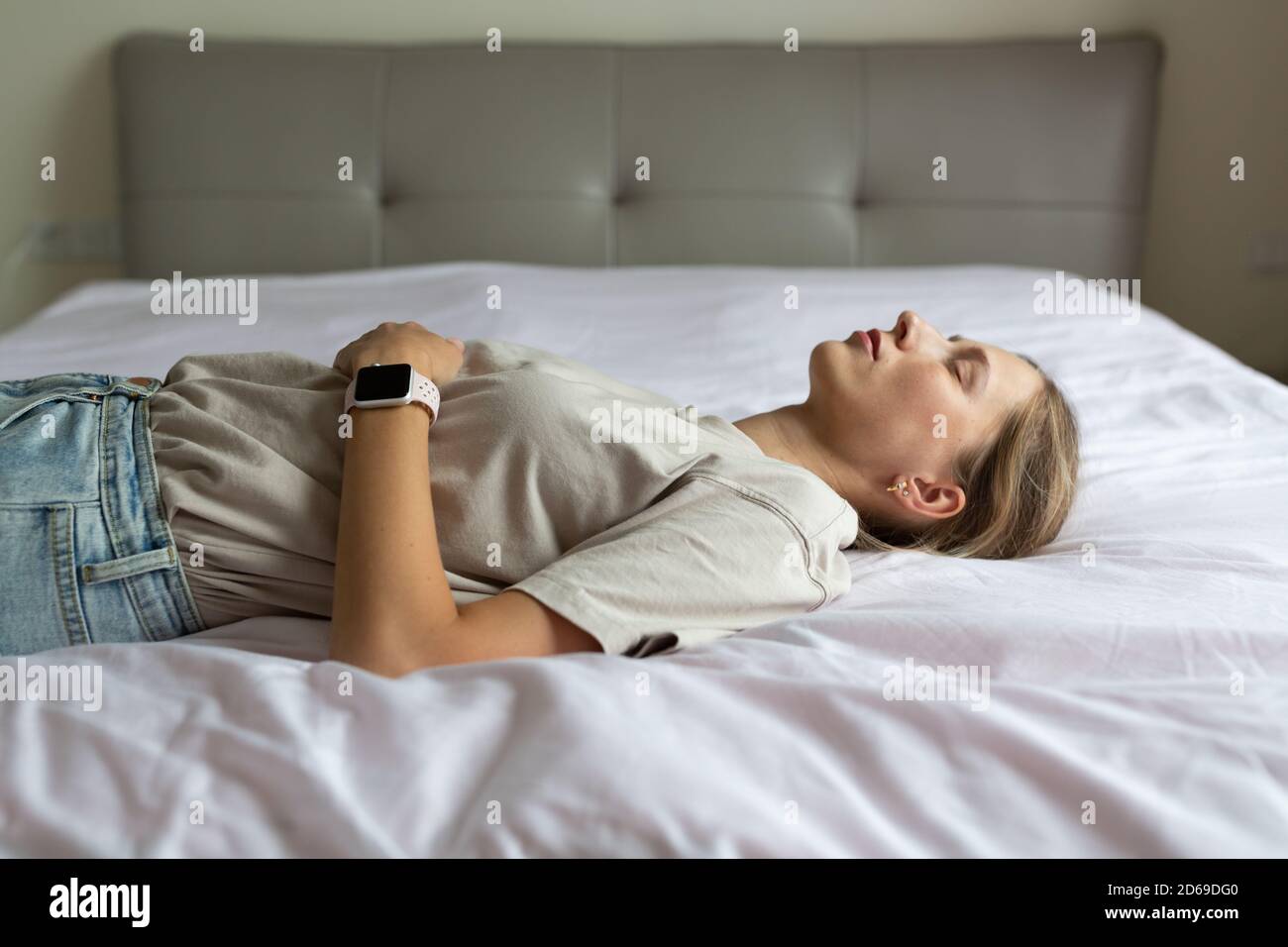 Tired after sleepless night young woman lying and resting on couch at ...