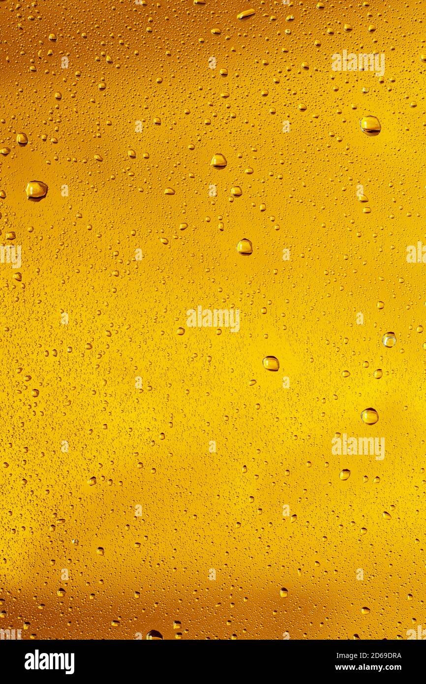 Close up view of cold drops on the glass of beer background. Texture of ...
