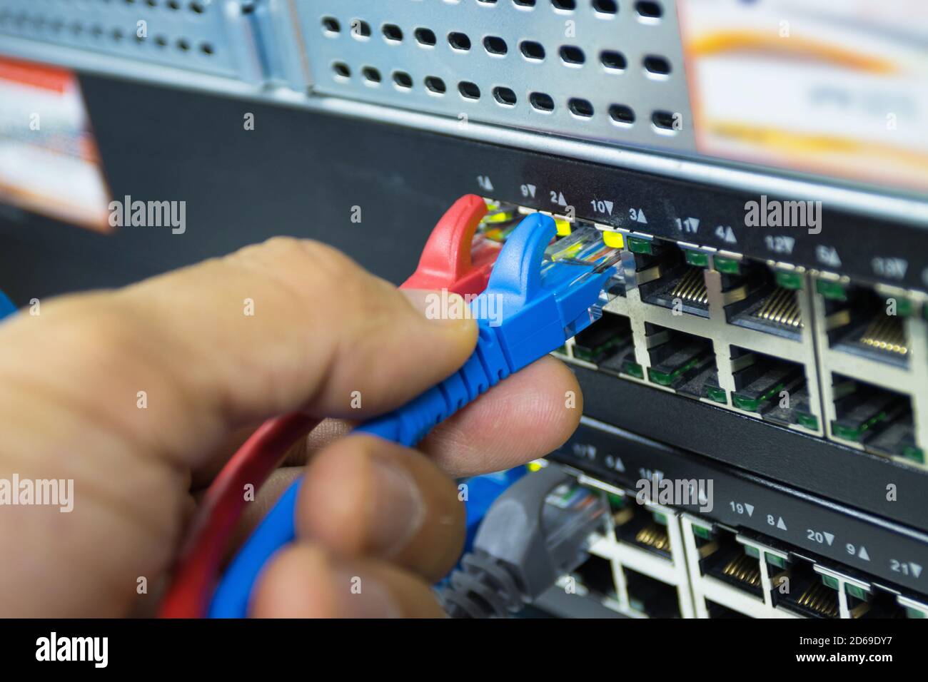 Hand of man holding The network cables to connect Lan port, concept ...