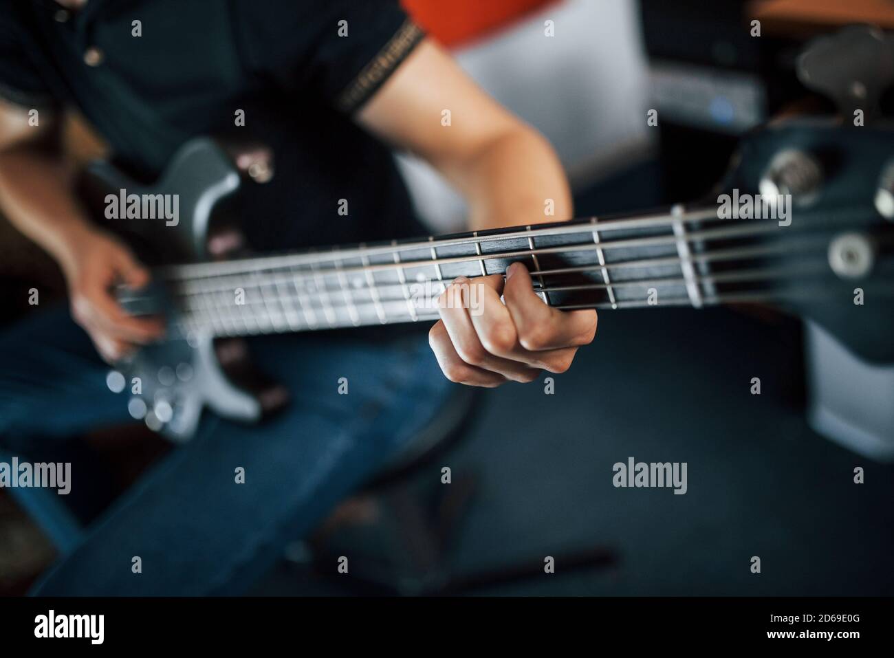 Musician plays bass guitar close hi-res stock photography and images ...