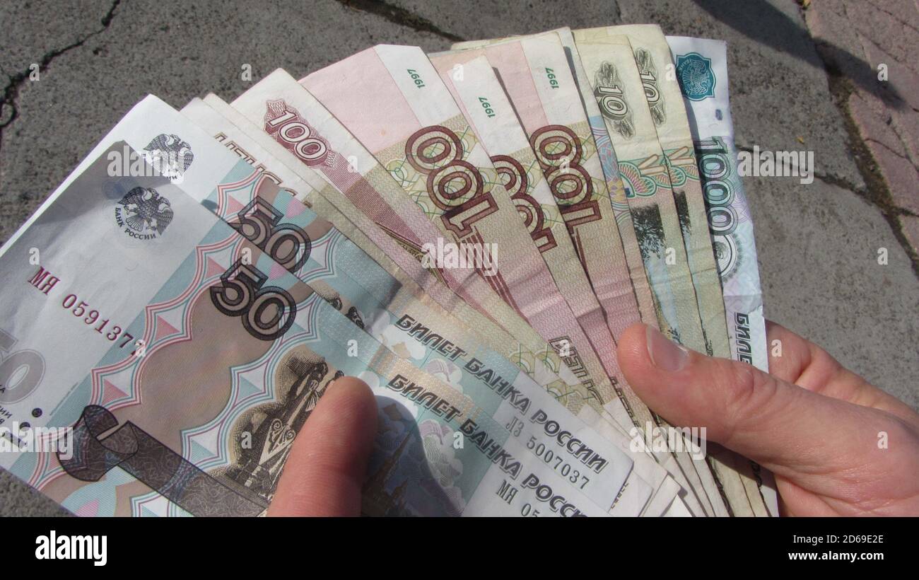 person on the street holding russian rubles bank notes in hands Stock ...