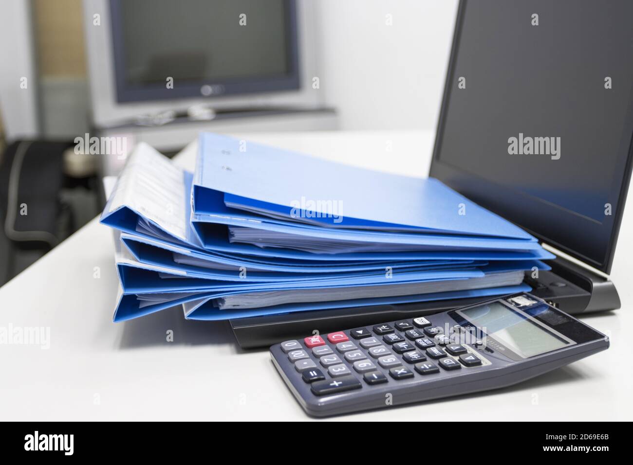 file folder with documents and Calculator With Notebook on table in ...