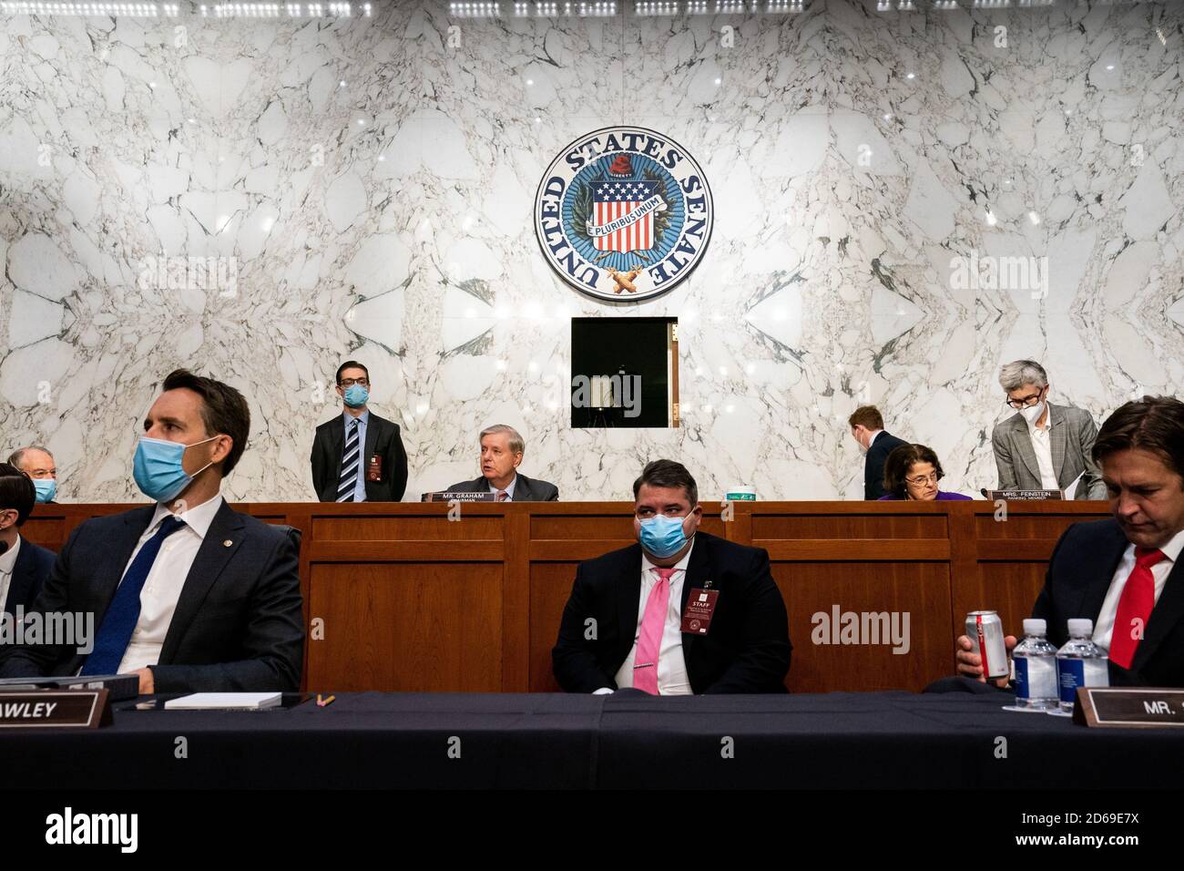 Members of the Senate Judiciary Committee participate in a business ...