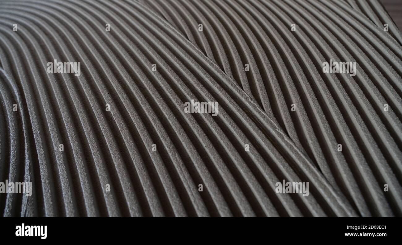 cementitious adhesive applied to the floor ready to receive the ceramic ...