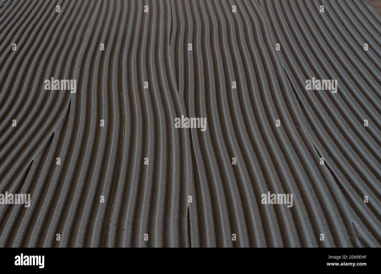 cementitious adhesive applied to the floor ready to receive the ceramic ...