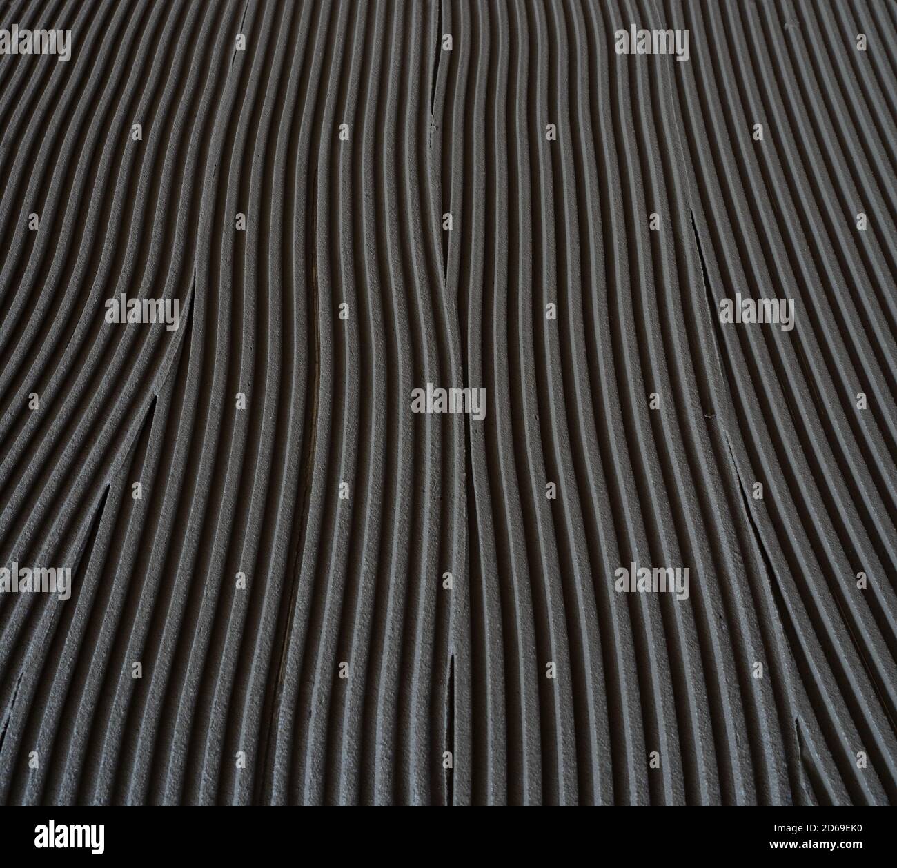 cementitious adhesive applied to the floor ready to receive the ceramic ...