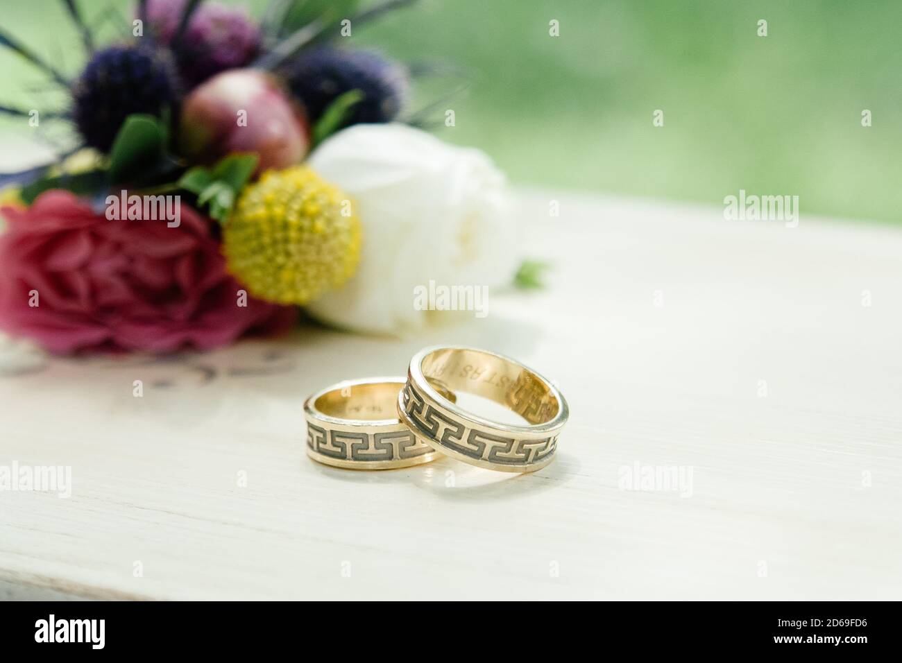 The wedding rings with flowers, marriage concept Stock Photo - Alamy