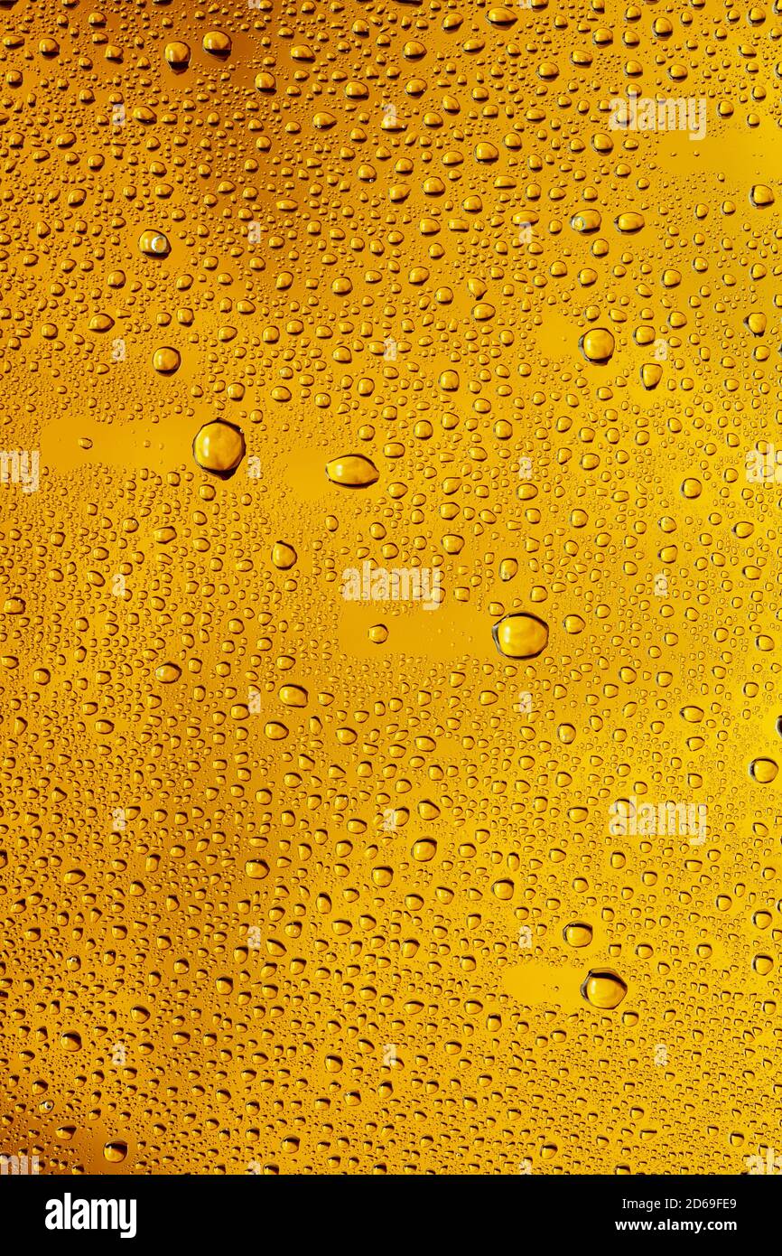 Close up view of cold drops on the glass of beer background. Texture of ...