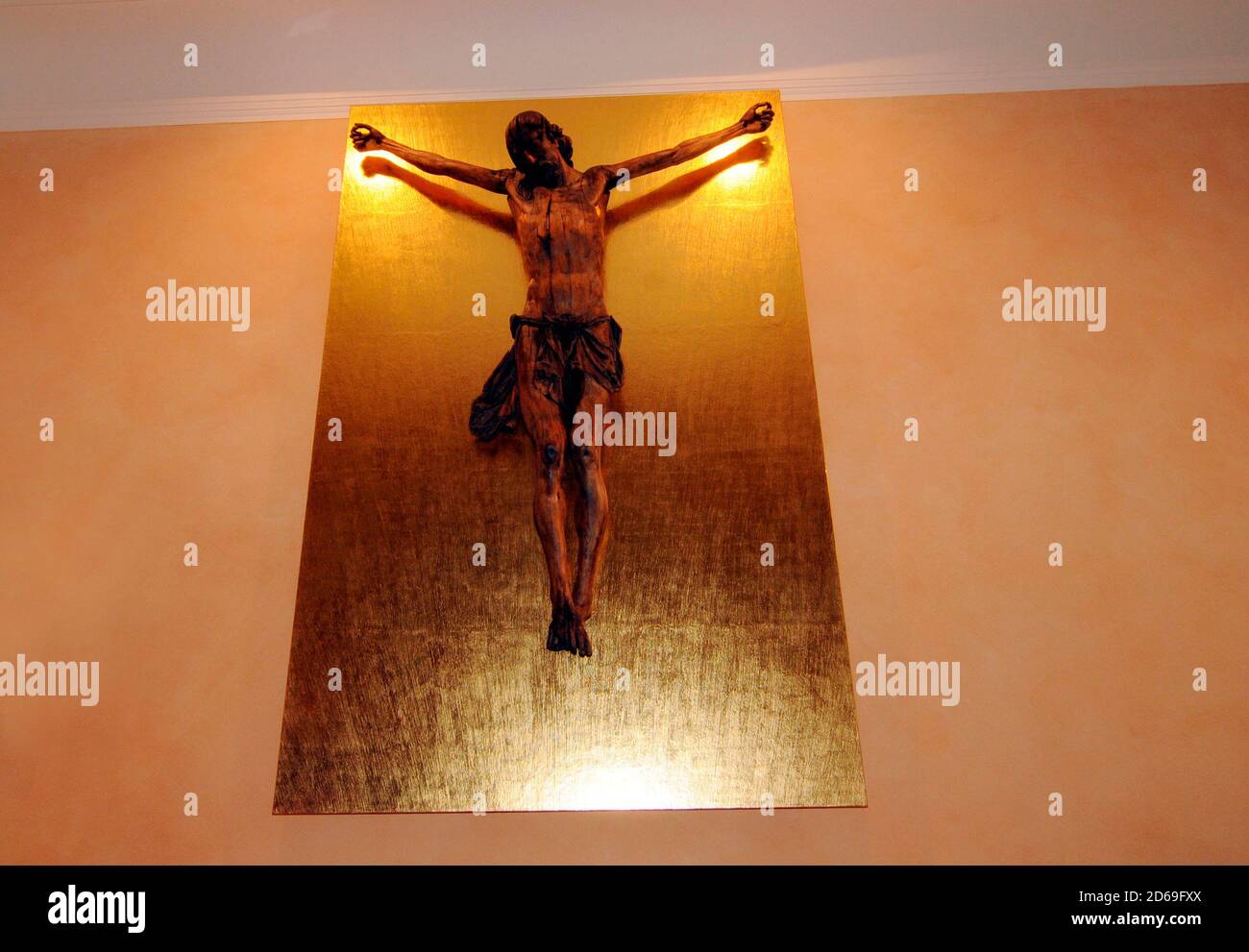 a Jesus Christ figure without cross hanging on golden plate Stock Photo ...