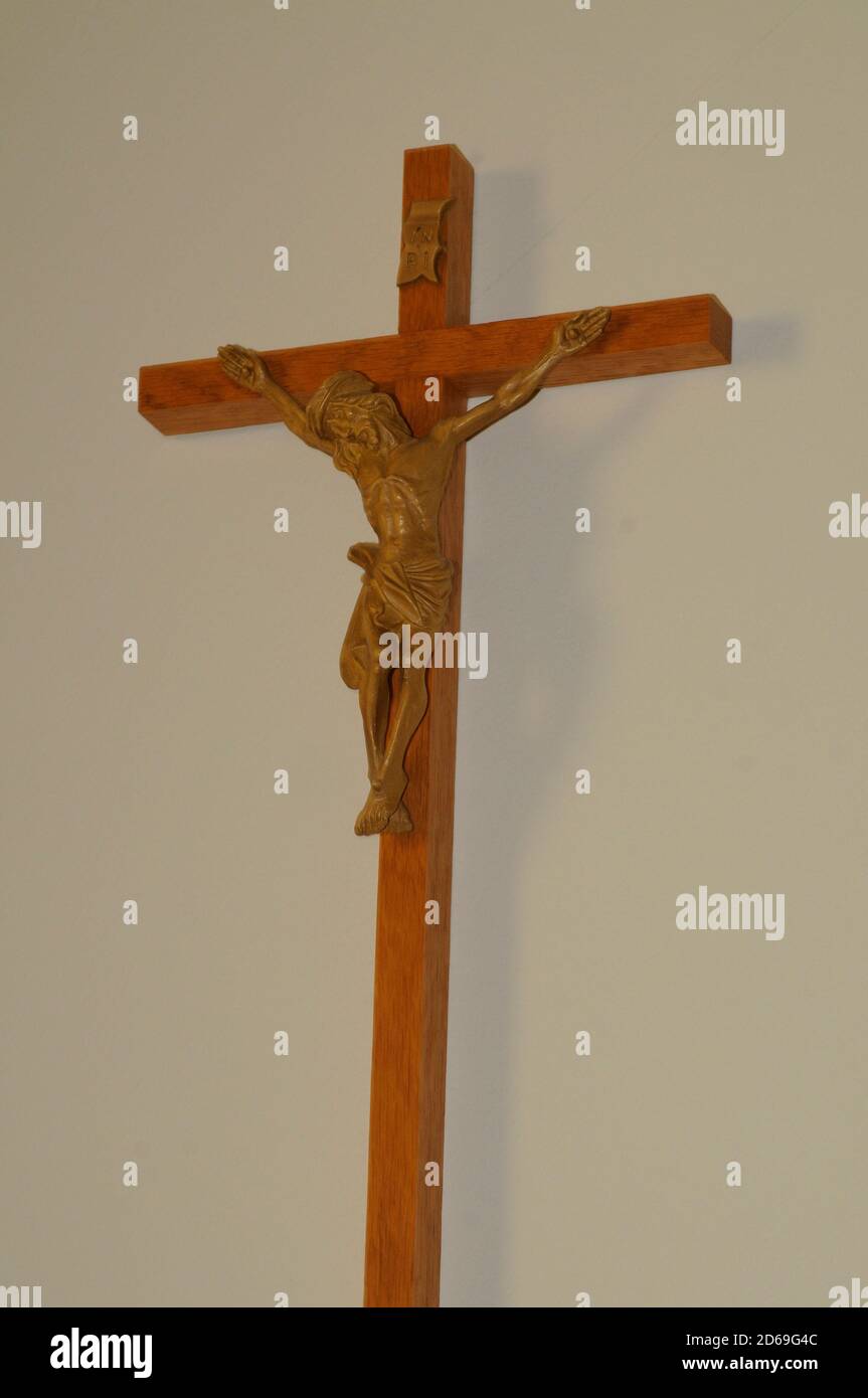 wooden Jesus Christ figure hanging on a cross in building Stock Photo ...