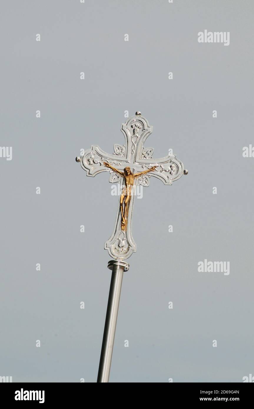 Jesus Christ figure hanging on cross on a crossbar, dark background ...