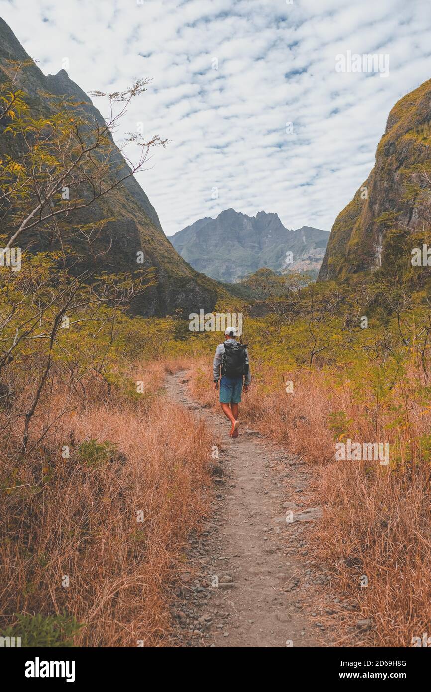 MAN HIKING IN A TROPICAL ISLAND, REUNION ISLAND Stock Photo - Alamy