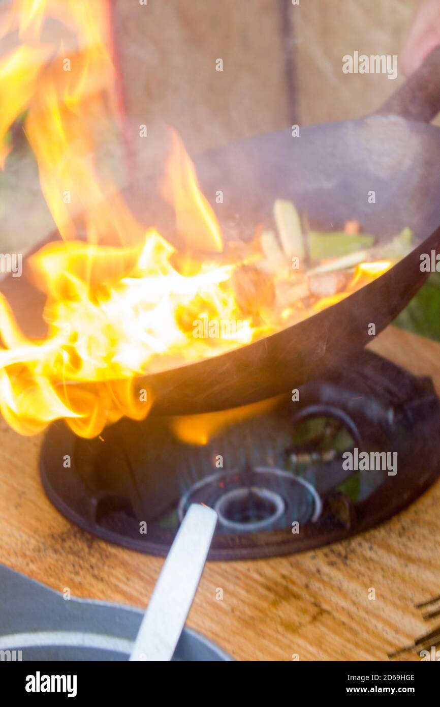 Chinese wok pan on fire hi-res stock photography and images - Alamy
