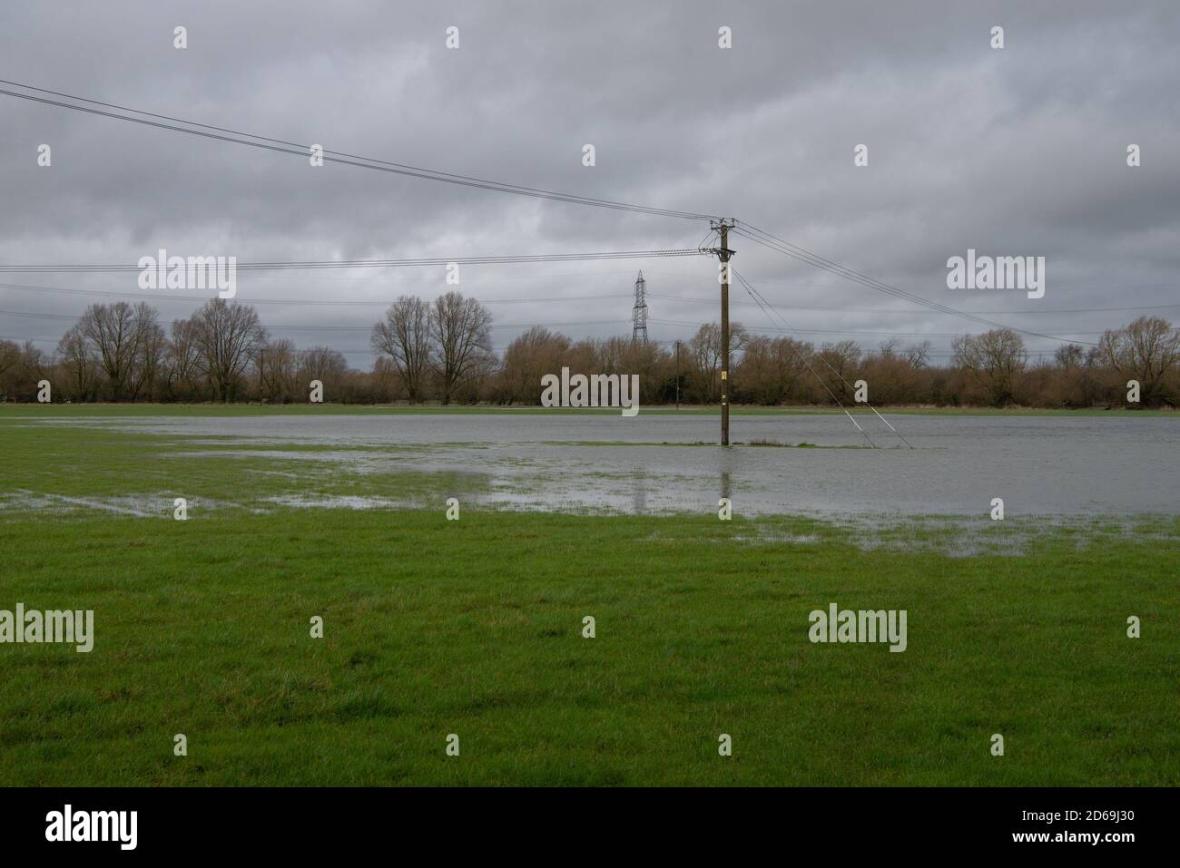 flooding Oxfordshire electricity pilon in water river burst its banks ...