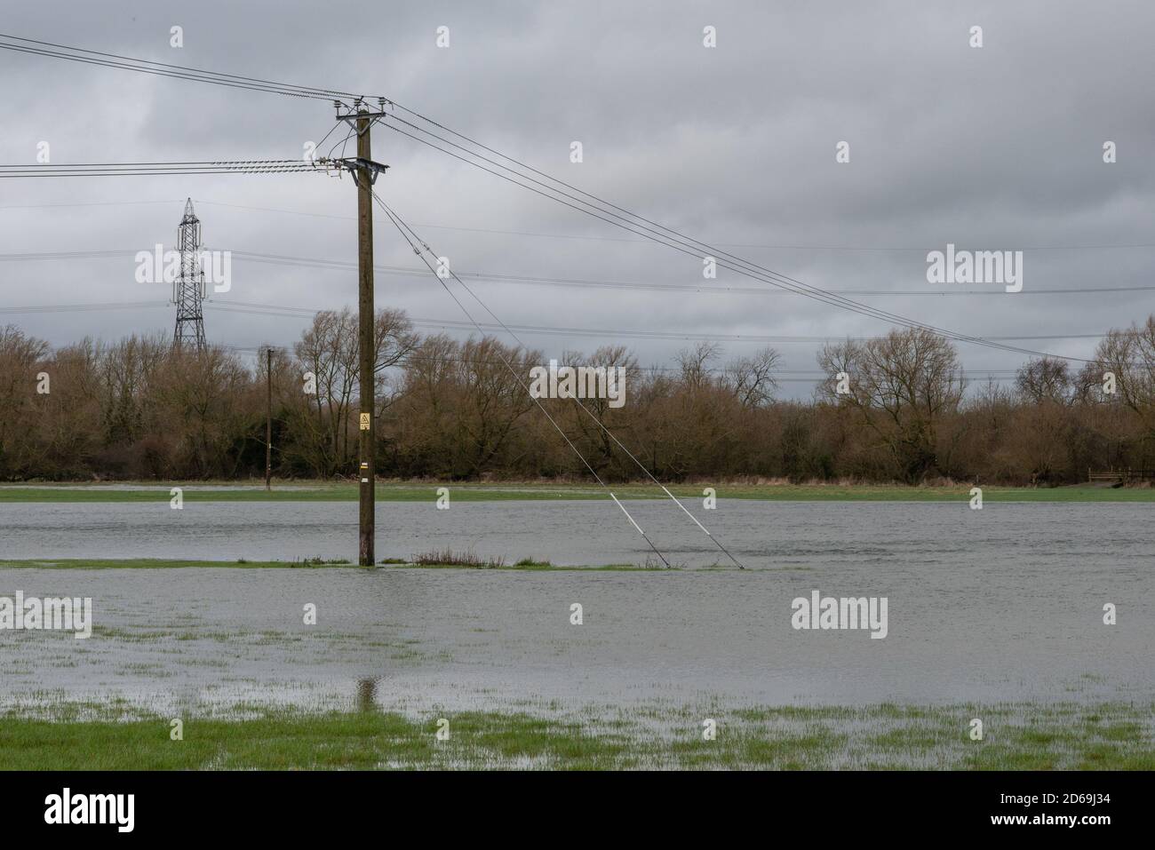 flooding Oxfordshire electricity pilon in water river burst its banks ...
