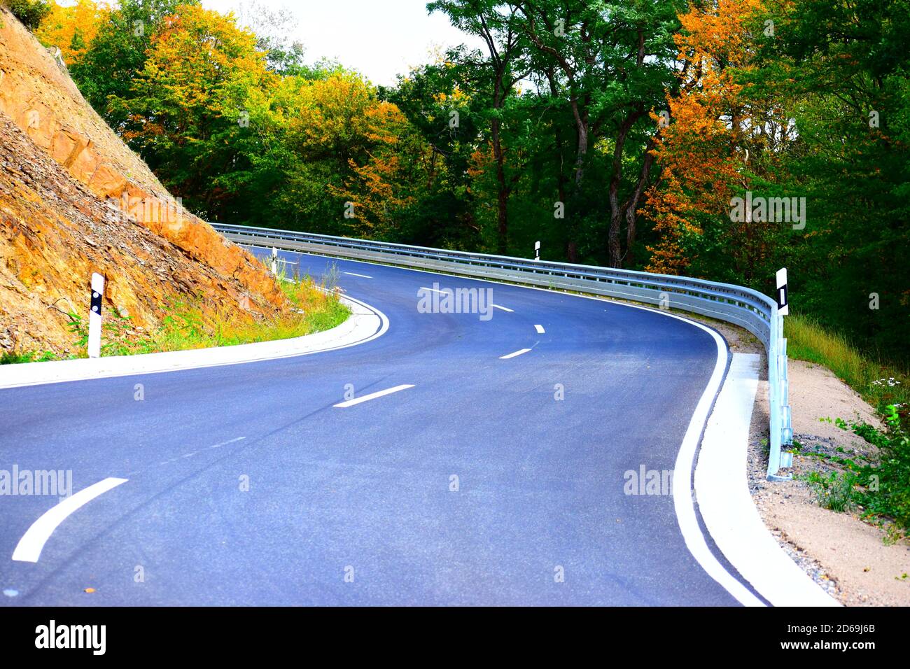 narrow country road in autumn Stock Photo - Alamy