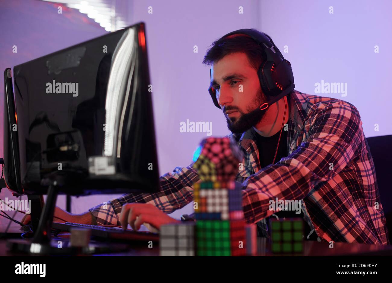 Portrait of young bearded pro gamer playing in online video game Stock ...