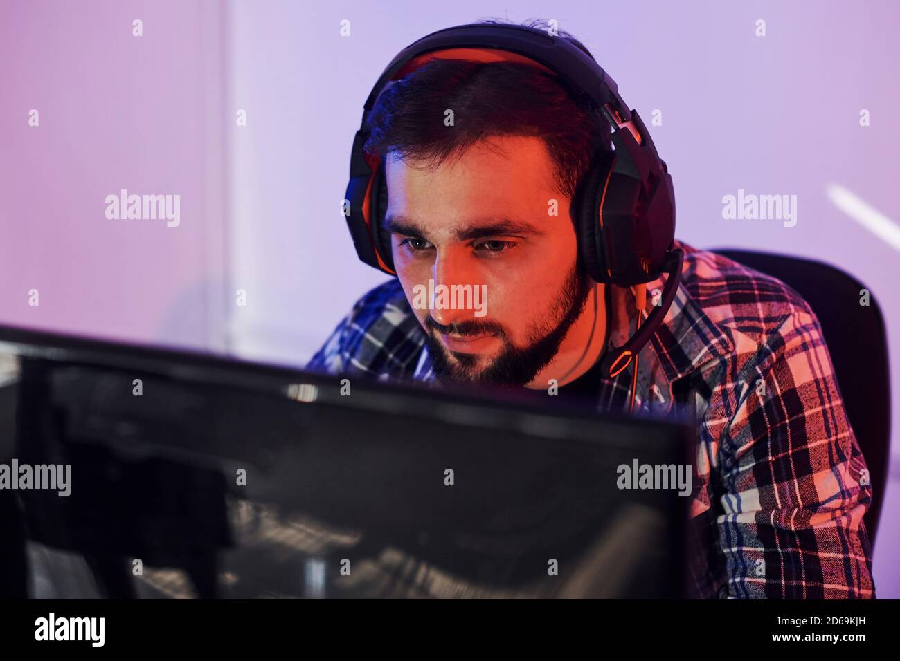 Portrait of young bearded pro gamer playing in online video game Stock ...